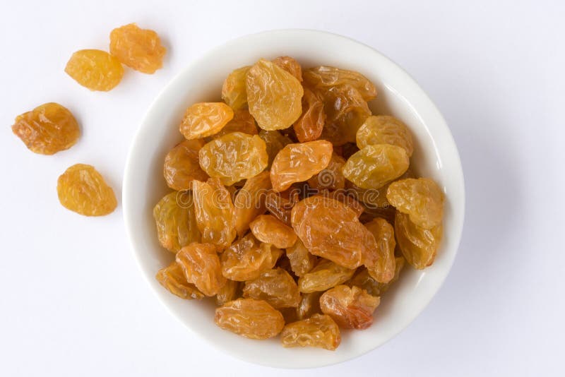 Golden Raisins in a Bowl stock image. Image of close - 271075503