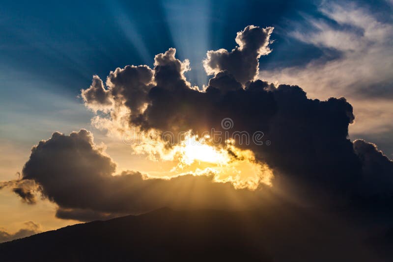 Golden Rays of the Sun through the Black Clouds Stock Image - Image of ...
