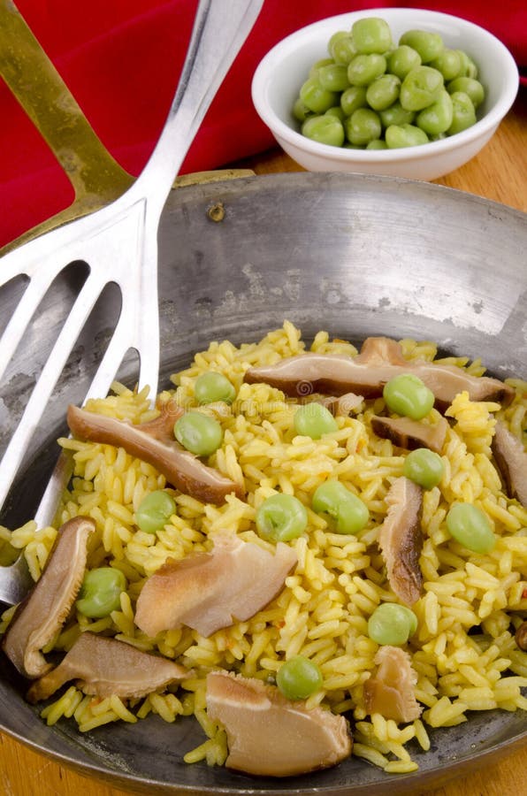 Golden Rice in Pan with Mushrooms Stock Photo - Image of fresh ...