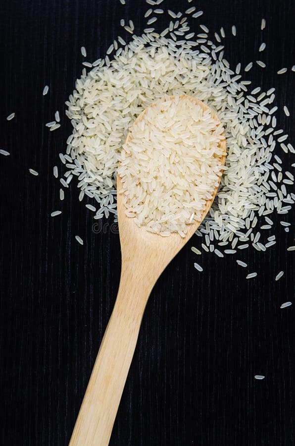 Golden Rice on Wooden Spoon Stock Image - Image of culture, calories ...