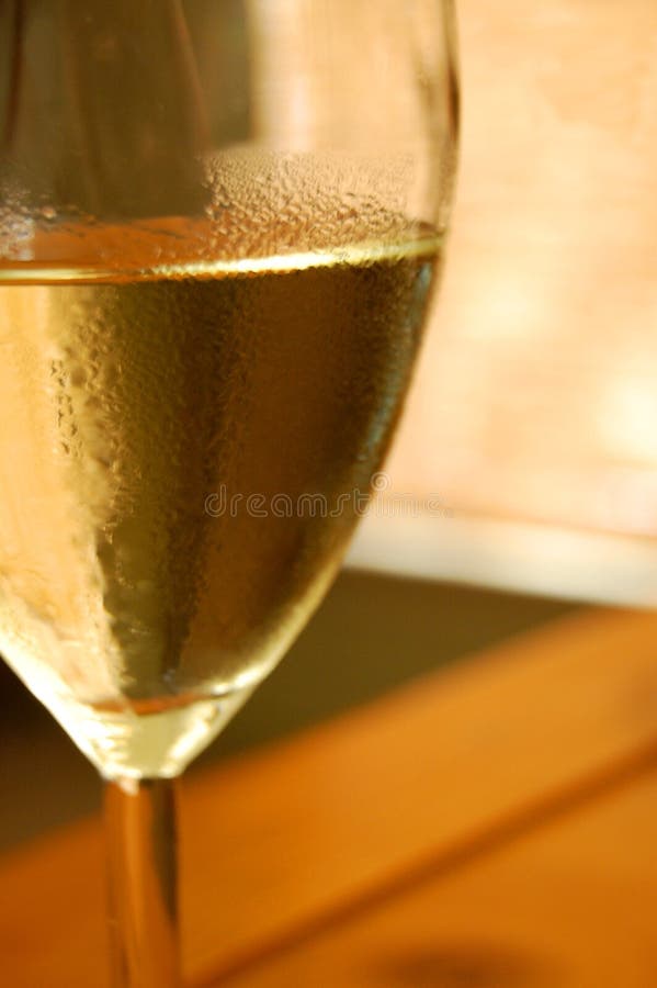 Golden Riesling in a glass stock image. Image of cold - 5557863