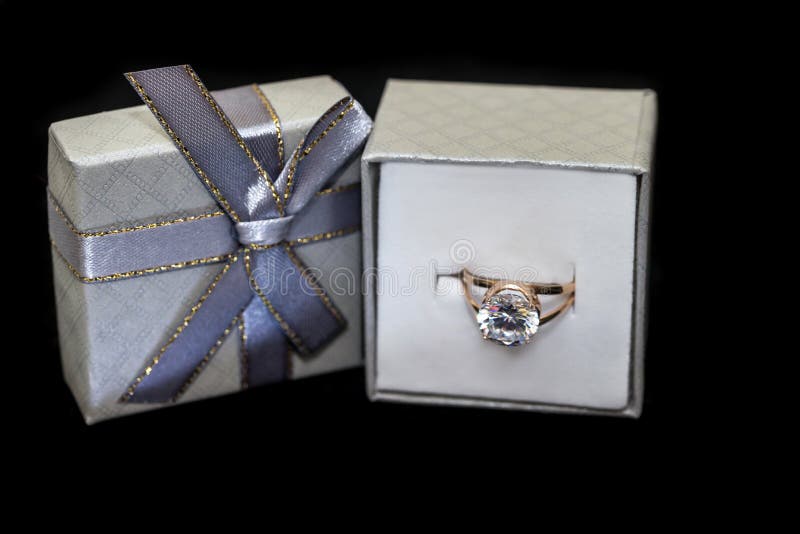 Golden Ring with Diamond in Box Isolated on Black Stock Image - Image ...