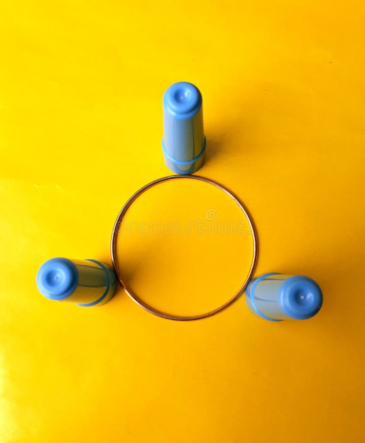 Golden Ring Placed between 3 Point Cap-sticks Stock Image - Image of ...