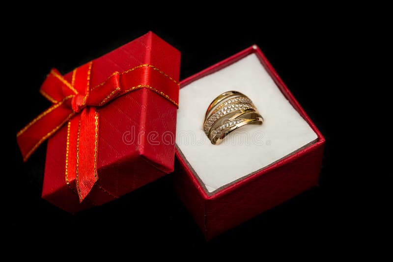 Golden Ring in Red Gift Box Isolated on Black Stock Photo - Image of ...