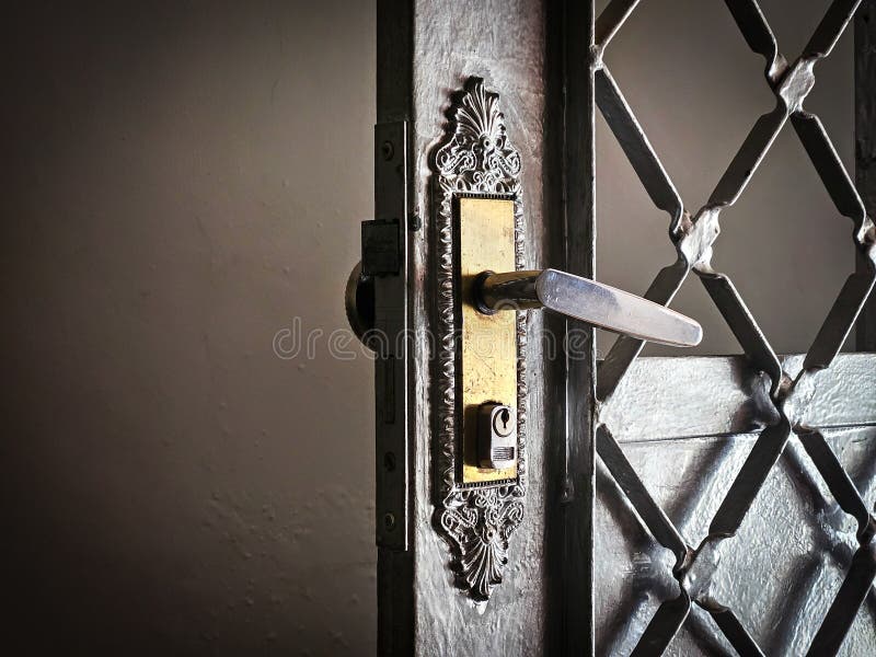 Golden Rustic Handle on Metal Door. Rusty Door Lock Stock Image - Image ...