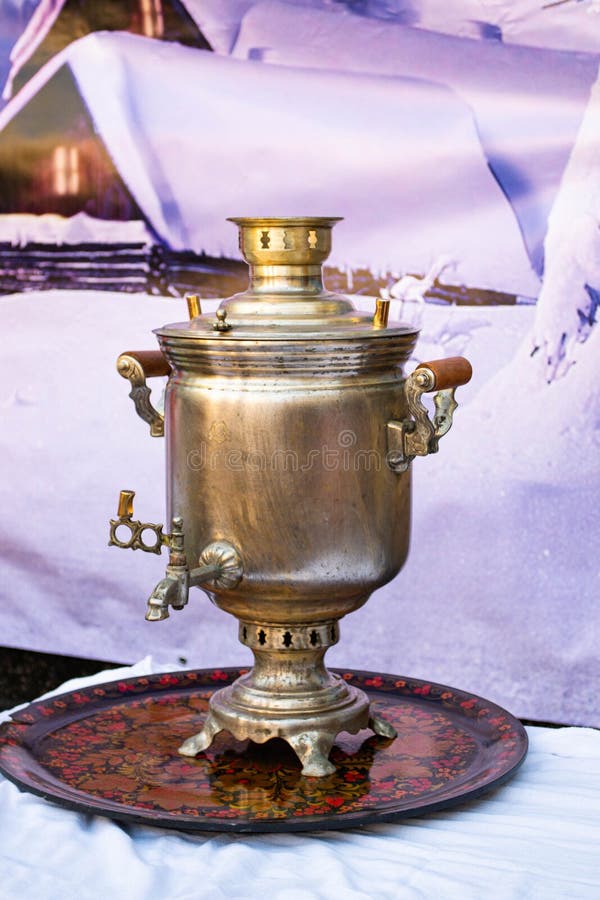 Golden samovar stock photo. Image of forgetmenot, hand - 189836520