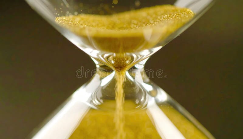 Golden Sand Flows through Clear Hourglass Symbolizing Time Passing ...