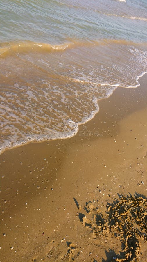 Beach and waves stock image. Image of beach, shallow - 126745395