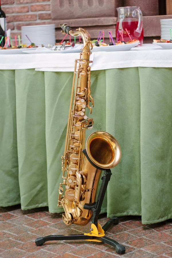 Golden Saxophone Staying on the Rack Stock Photo - Image of golden ...