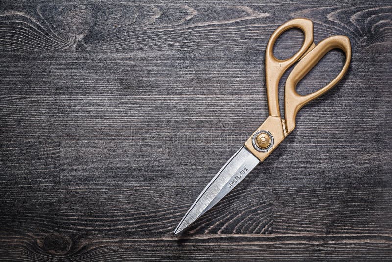 Golden Scissors on Vintage Wooden Board Stock Image - Image of wooden ...