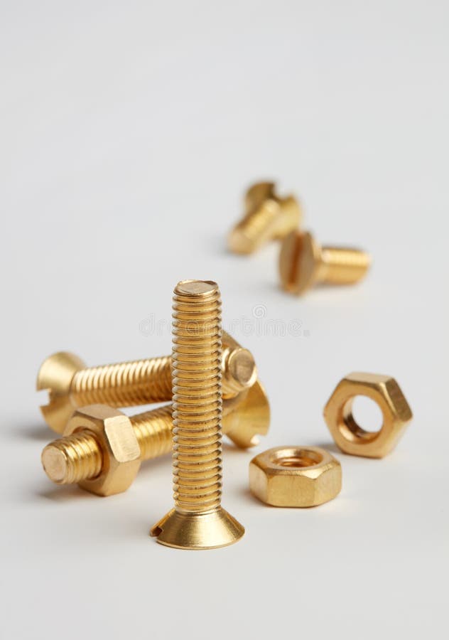 Golden screws and bolts stock image. Image of fastener - 197138041