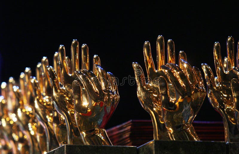 Golden sculpture hands editorial stock image. Image of background ...