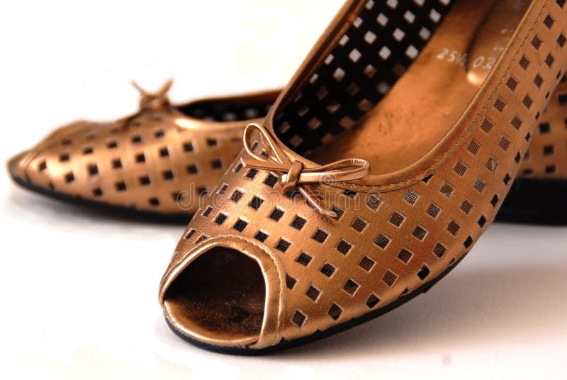 Golden shoes stock photo. Image of leaky, cute, gold - 10569670