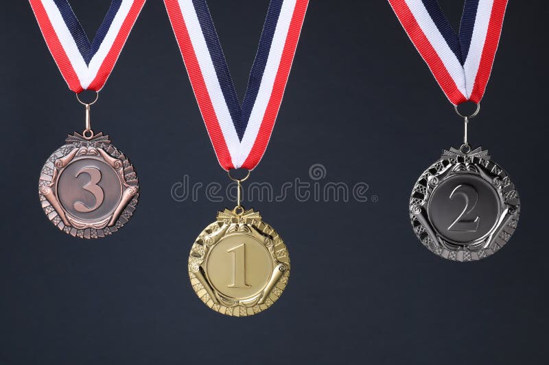 Golden, Silver and Bronze Medals on Dark Grey Background Stock Photo ...