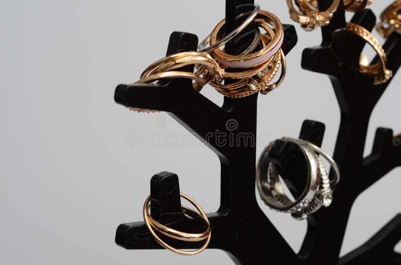 Golden and Silver Rings on Jewelry Tree Stock Photo - Image of jewelry ...