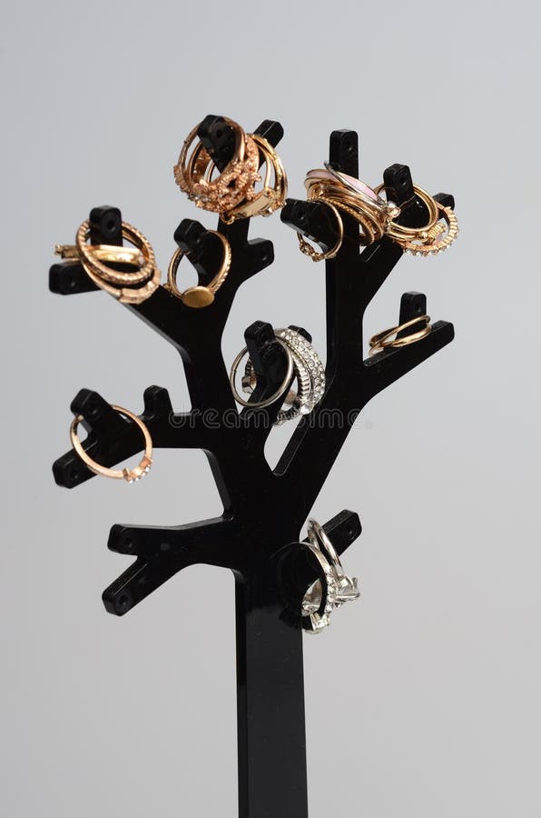 Golden and Silver Rings on Jewelry Tree Stock Photo - Image of tree ...