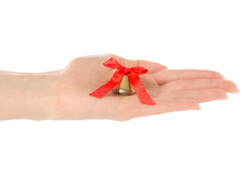 Golden small bell in hand stock photo. Image of icon - 109411092