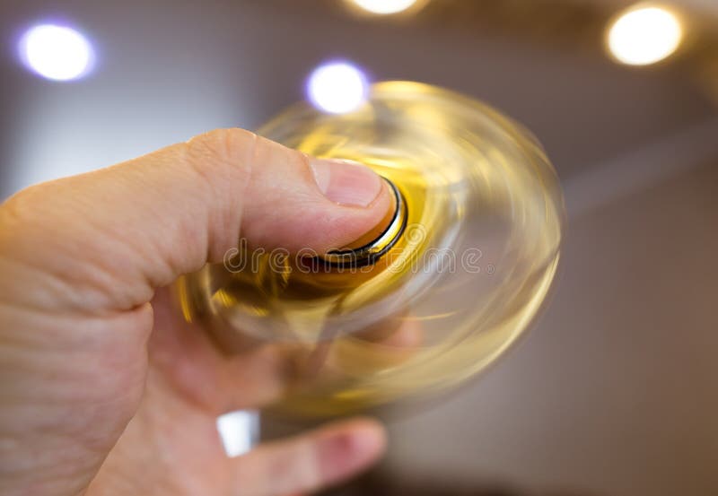 The Golden Spinner is Spinning in His Hand Stock Image - Image of trend ...