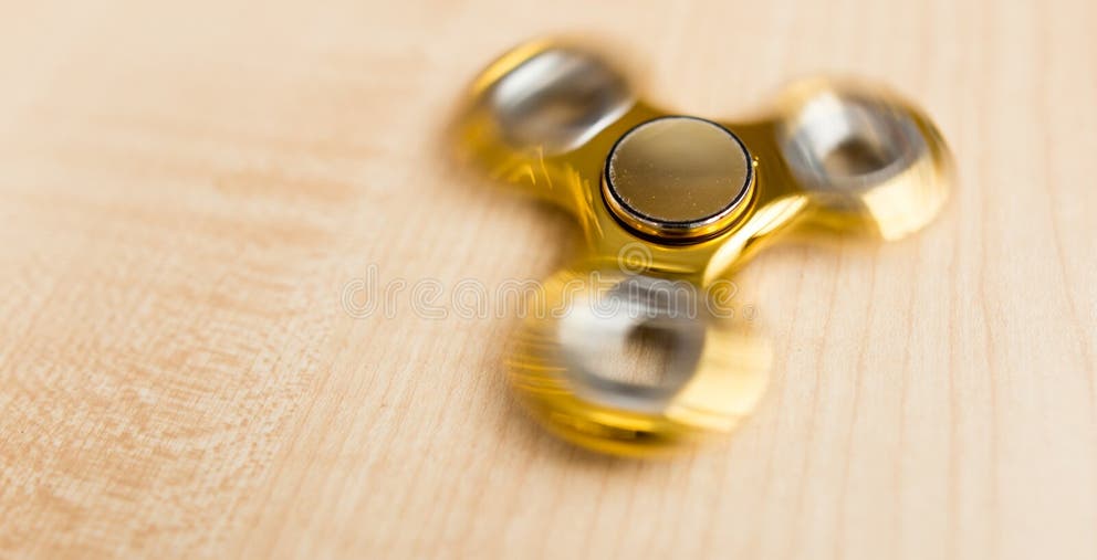 The Golden Spinner is Spinning on the Table Stock Image - Image of ...