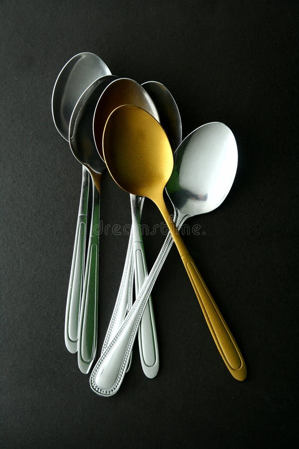 Golden Spoon among Ordinary Spoons Stock Photo - Image of financial ...
