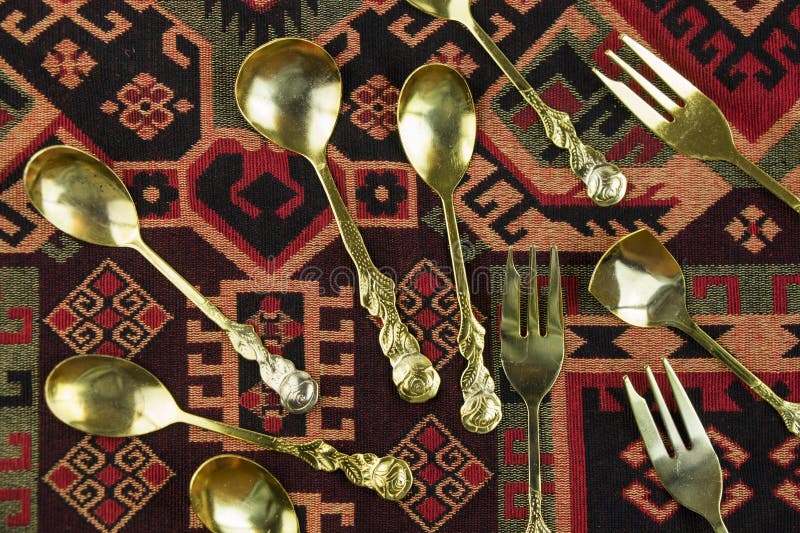 Golden spoons on the table stock image. Image of collections - 273967921