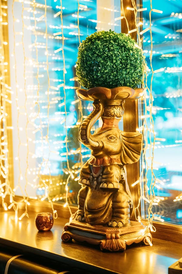 Golden Statue of Elephant Lighted by Bokeh Boke Lights. Interior ...