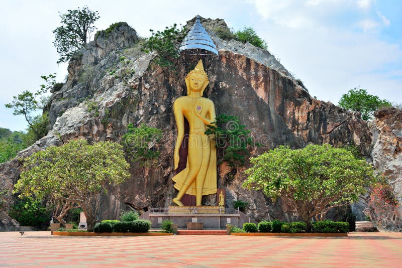 Golden Stone Statue of a Buddha Stock Image - Image of sculpture ...