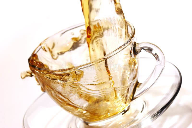 Golden stream of tea stock photo. Image of drink, macro - 1010608