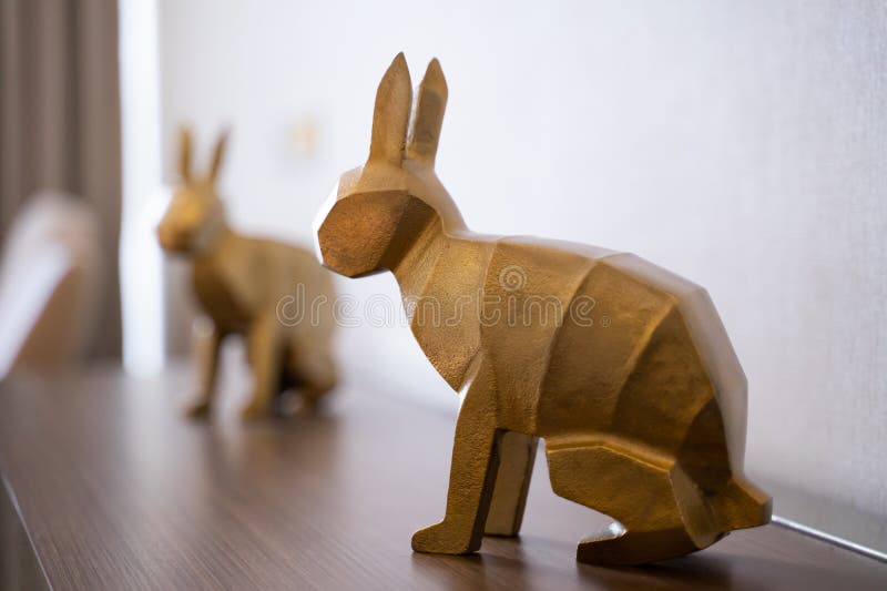 Golden Stucco Rabbit Figurine in Modern Shape on Table for Home ...