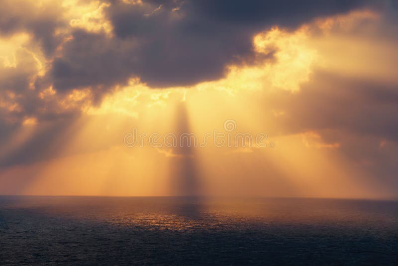 Golden Sun Rays On The Sea At Sunset Stock Photo - Image of dramatic ...