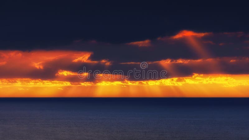 Golden Sun Rays on the Sea at Sunset Stock Photo - Image of dramatic ...