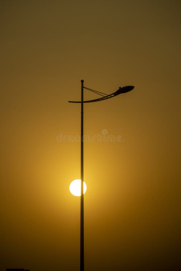 Golden Sun during Sunset and Lamp Post Stock Image - Image of post ...