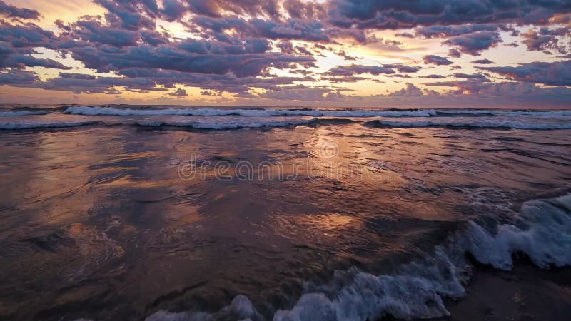 Golden Sunlight Reflecting on Rippling Ocean Surface, Gentle Waves ...