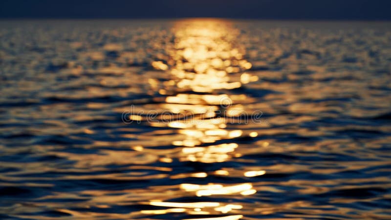 Golden Sunlight Reflecting on Tranquil Water Surface, Creating a Serene ...