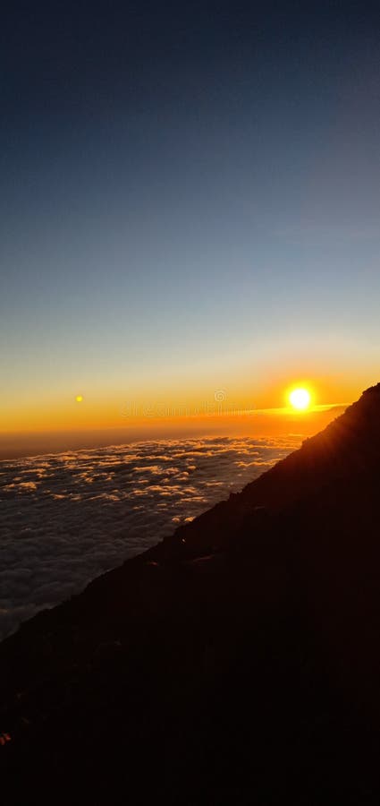 The Golden Sunrise of Mahameru Stock Photo - Image of island, ocean ...