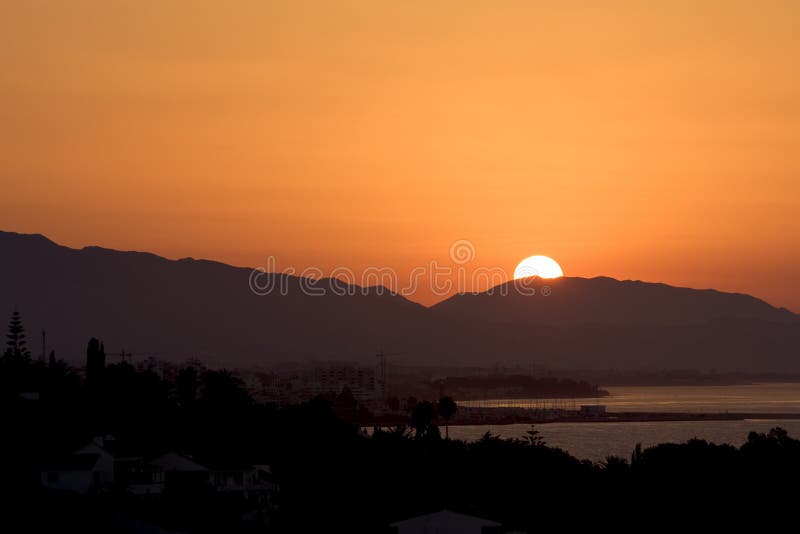 Golden Sunrise Over Port of Marbella Stock Photo - Image of glow ...