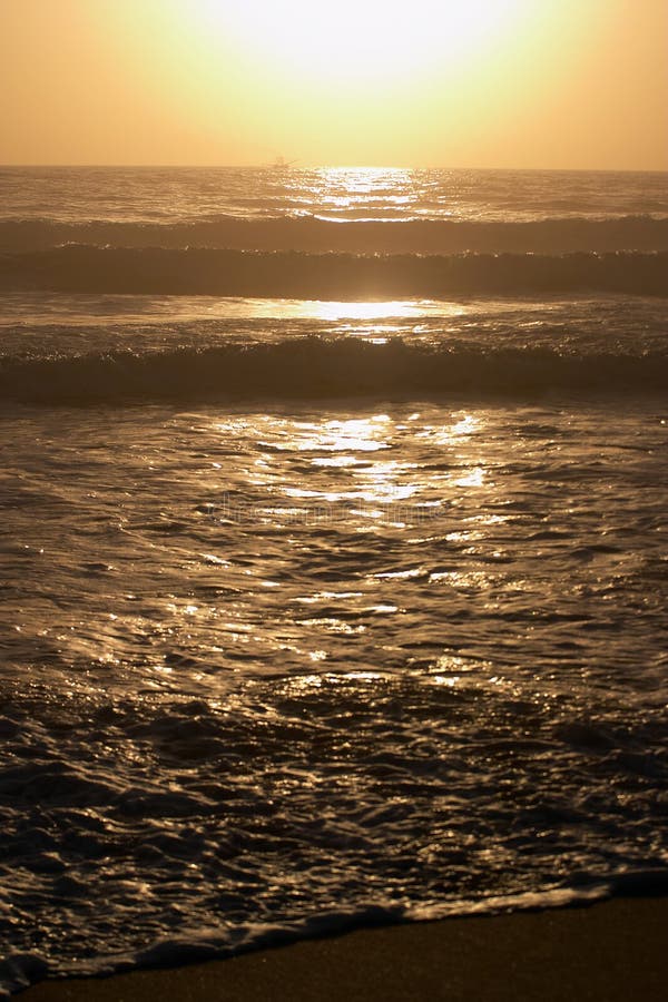 Golden sunset stock photo. Image of beach, glistening, wave - 603476