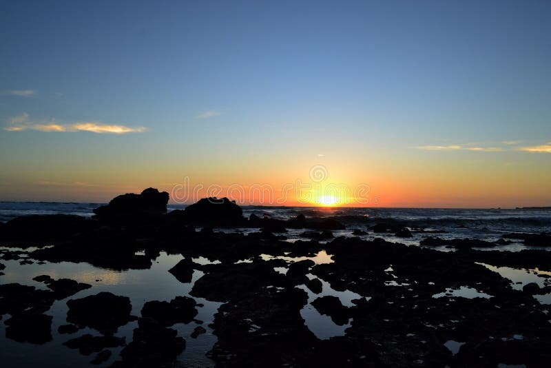 Golden Sunset at a Beach with Rocks and Rock Pools Stock Photo - Image ...