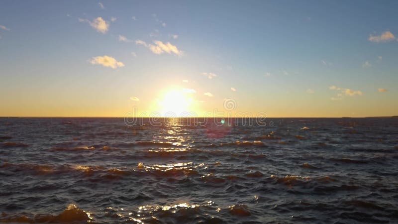 Golden Sunset Over Ocean Waves Captures Serene Horizon and Dynamic Sky ...