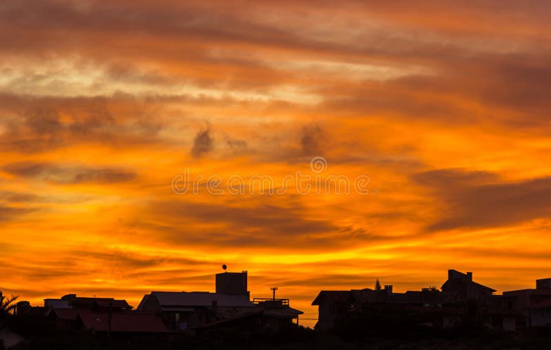 Golden Sunset Over The Silhouettes Of Buildings Stock Photo - Image of ...