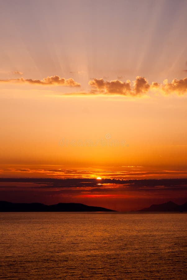 Golden Sunset with Rays Above Clouds, Sun Covered by Cloud Stock Photo ...