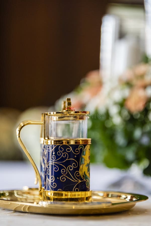 Golden teapot on the table stock photo. Image of drink - 295170510