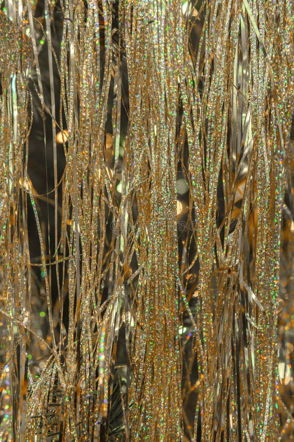 Golden Threads of Artificial Rain Sparkle on the Christmas Tree. Stock ...