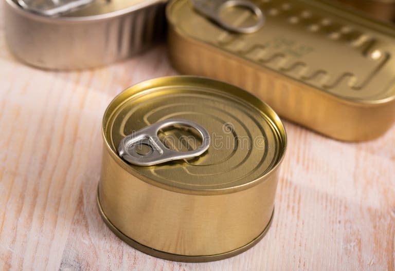 Golden tin can on table stock image. Image of golden - 319038079