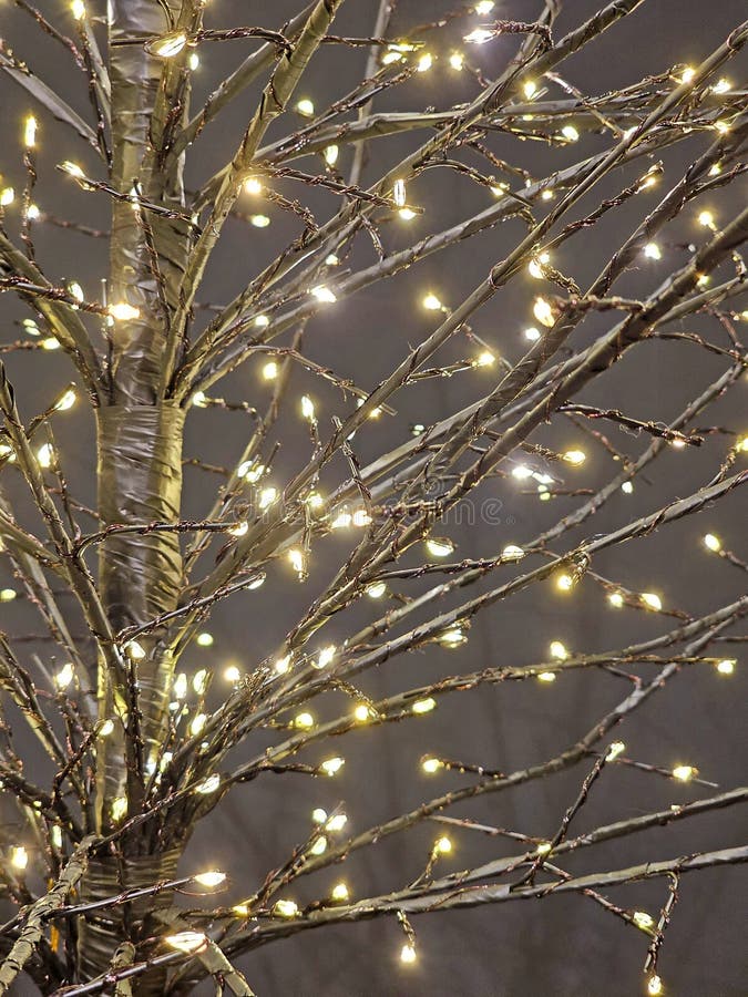 Golden tree with lights stock image. Image of closeup - 300179893