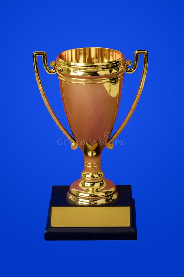 Golden trophy cup on blue stock photo. Image of golden - 166836864
