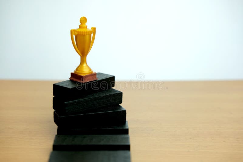 Golden Trophy Standing on White Podium Stock Image - Image of champion ...