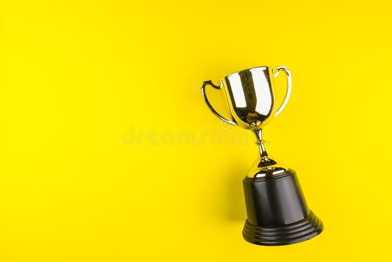 Golden Trophy on Yellow Background.Concept Championship Stock Image ...