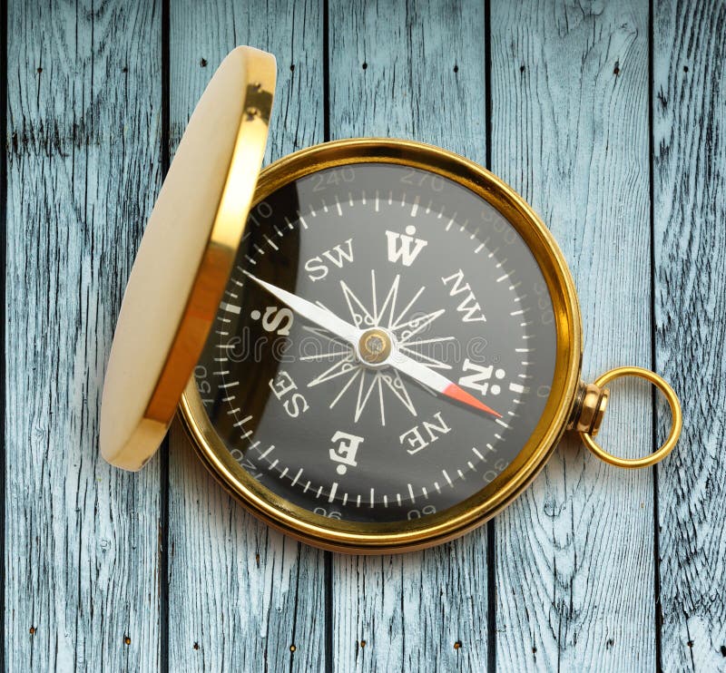 Golden Vintage Compass on Wood Stock Photo - Image of circle, direction ...