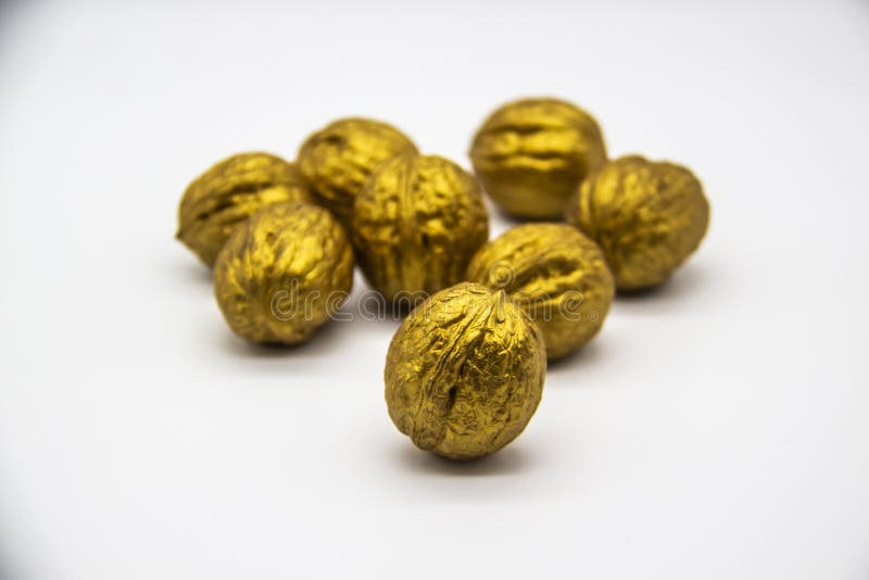 A Golden Walnuts on a White Background.Eight Walnuts. Walnuts Stock ...